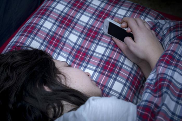 Soak in the sunshine during the day to look at your phone before bed